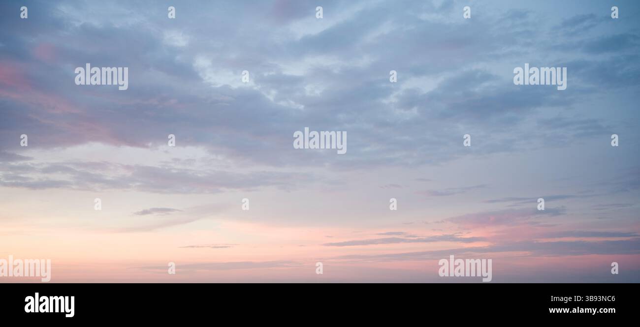 Subtle Sunset Sky: Pastel Clouds Stock Photo - Alamy