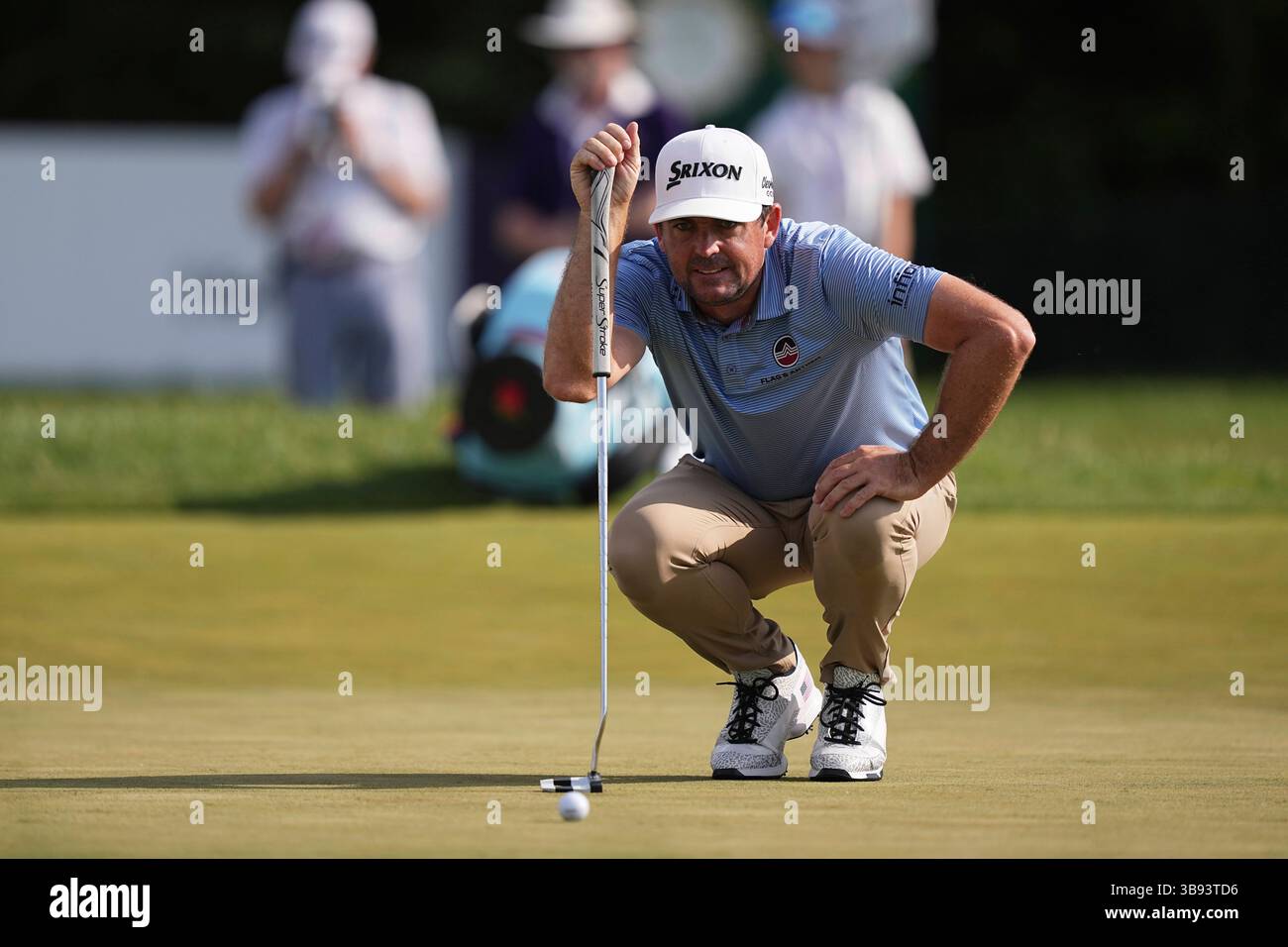 Keegan Bradley lines his putt on the ninth green during the first round ...