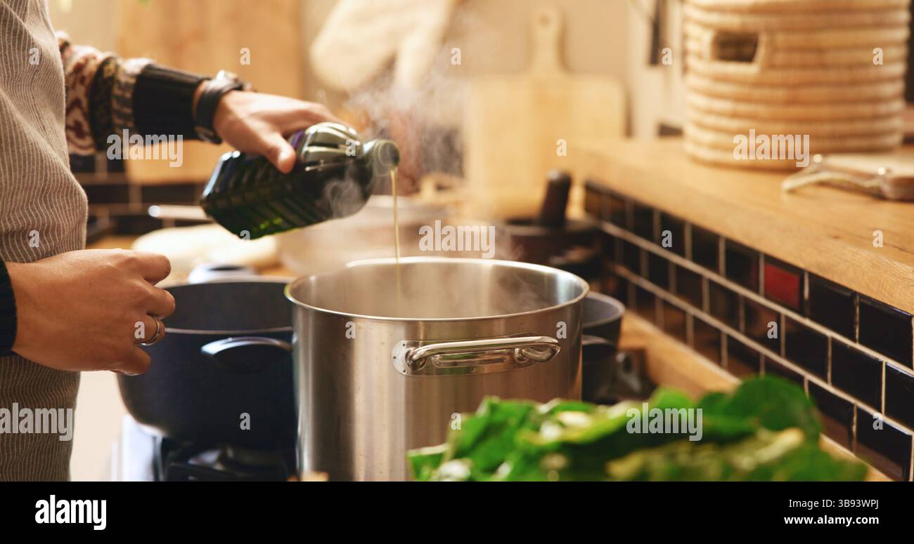 Cooking, hands and olive oil with person in kitchen of home for flavor ...