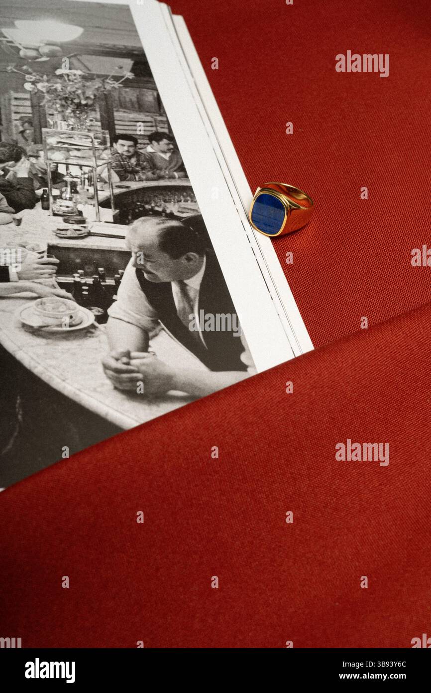 Gold Signet Ring with Blue Stone on Edge of Vintage Photograph - Red ...