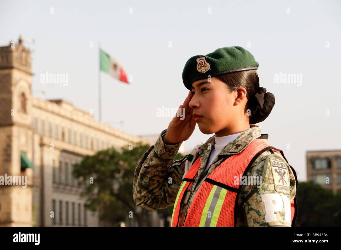 Lowering Ceremony of the Mexican Flag A military woman of the Mexican ...