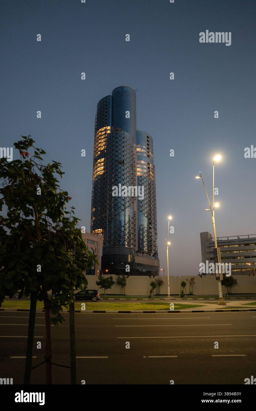 A captivating view of Doha's towering skyscrapers illuminated at night ...