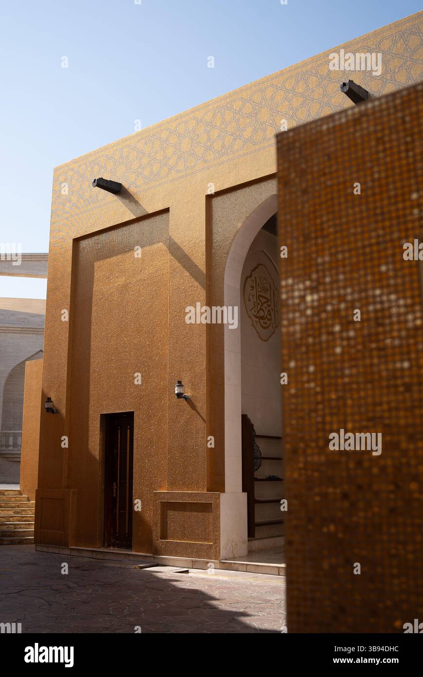 The stunning Golden Mosque in Katara Cultural Village, Doha, Qatar, with its shimmering golden ...
