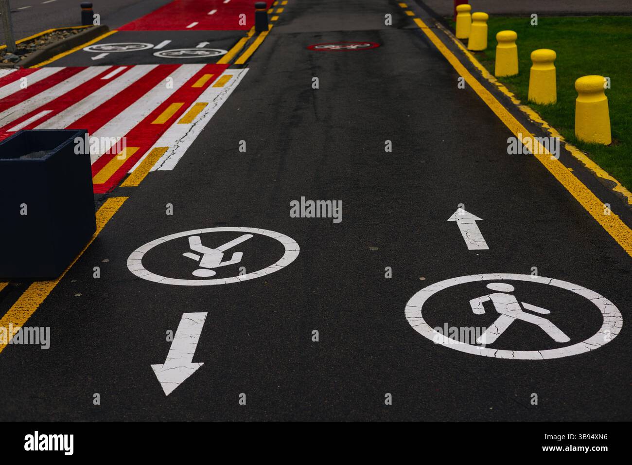 A designated pedestrian and bicycle path is marked with signs and lines ...