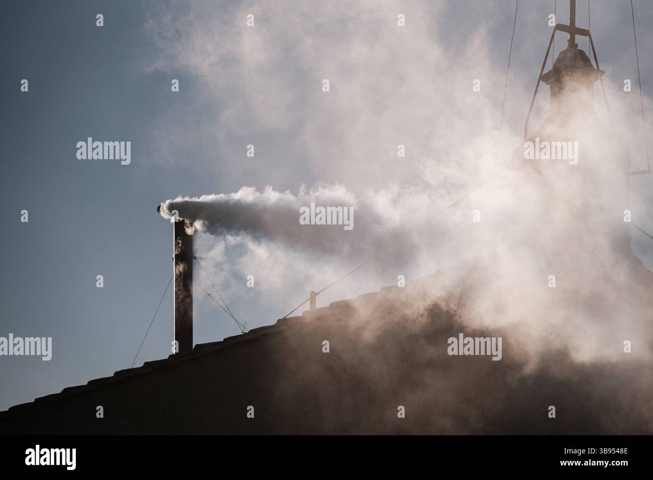 Vatican, the chimney on the roof of the Sistine Chapel announces the ...