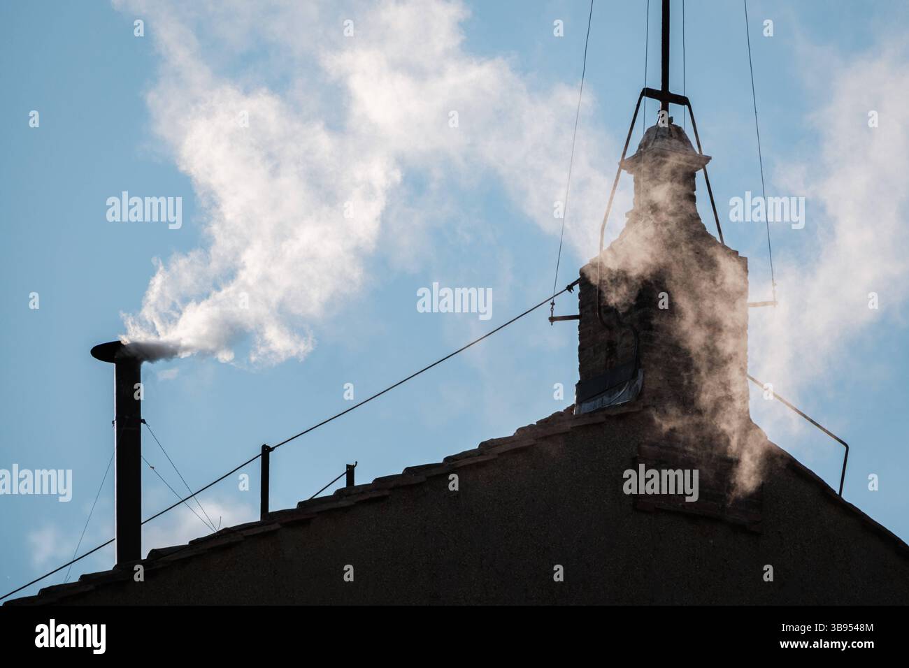 Vatican, the chimney on the roof of the Sistine Chapel announces the ...