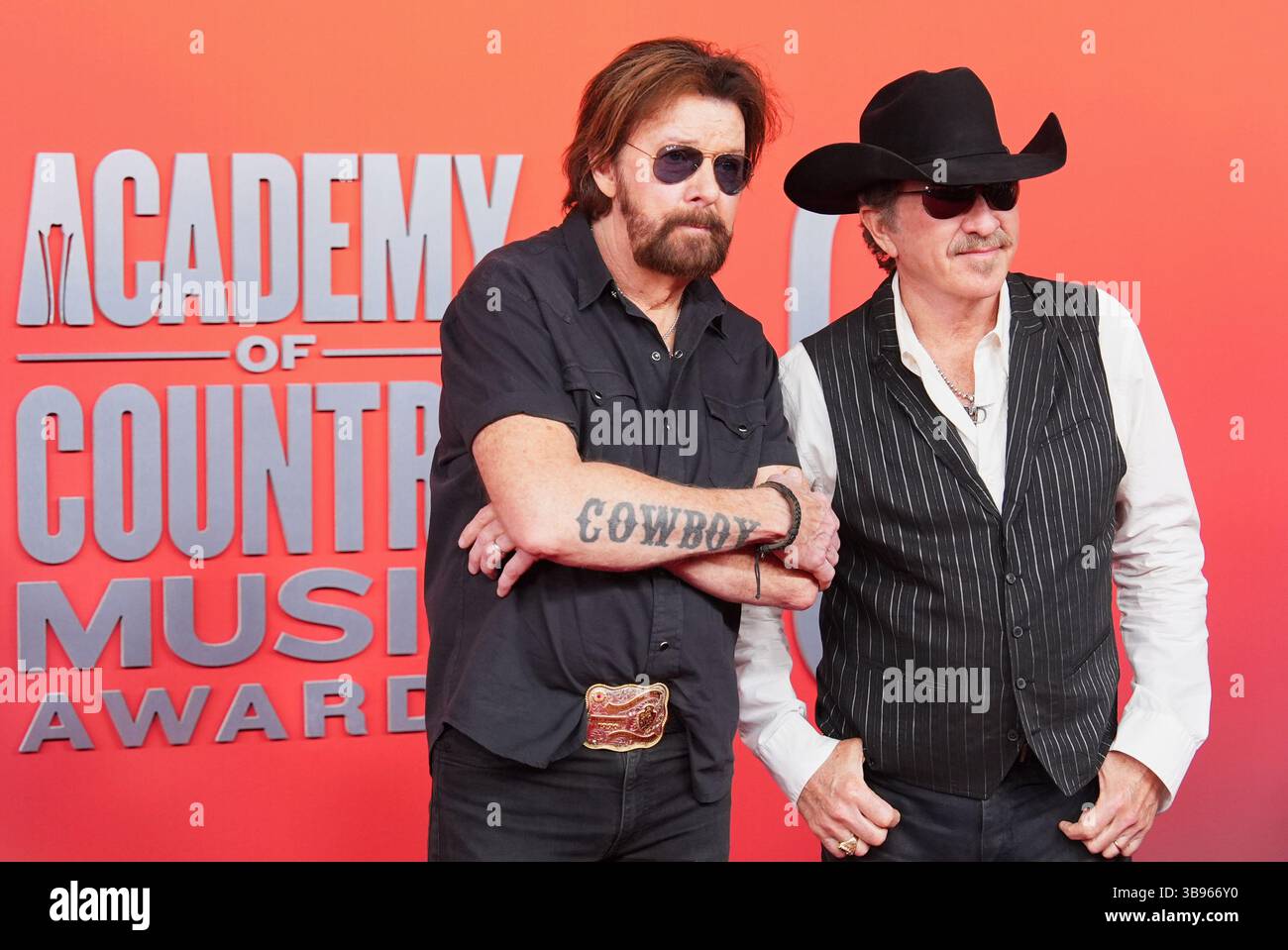 Ronnie Dunn, left, Kix Brooks of Brooks & Dunn arrive at the 60th ...