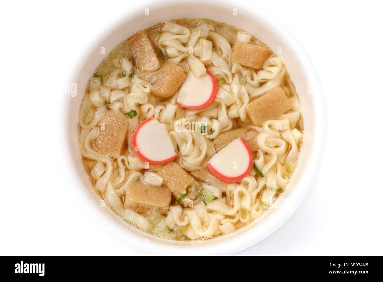 boiled instant Udon noodles in a cup on white background Stock Photo ...