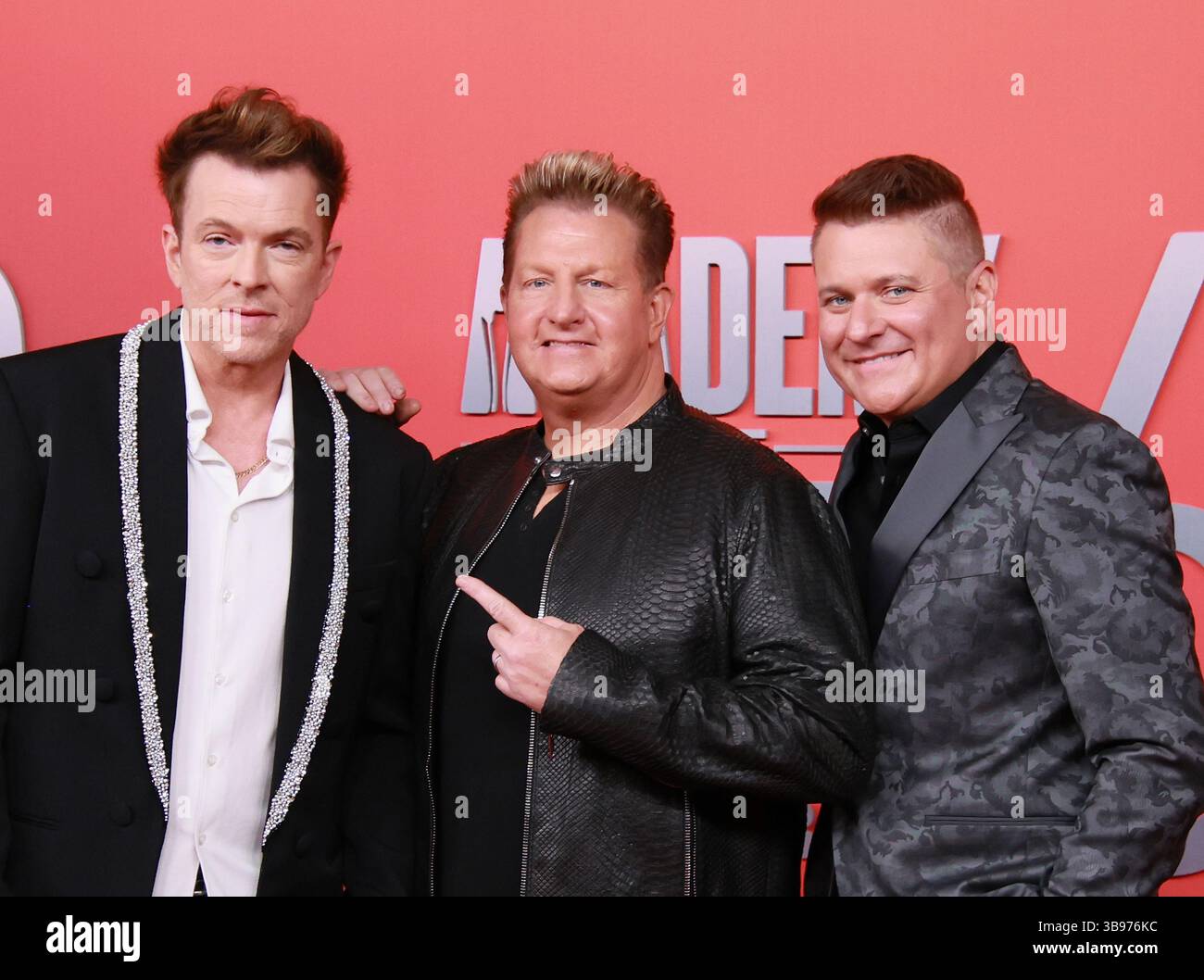 JoeDon Rooney, Gary LeVox, and Jay DeMarcus of Rascal Flatts attend the ...