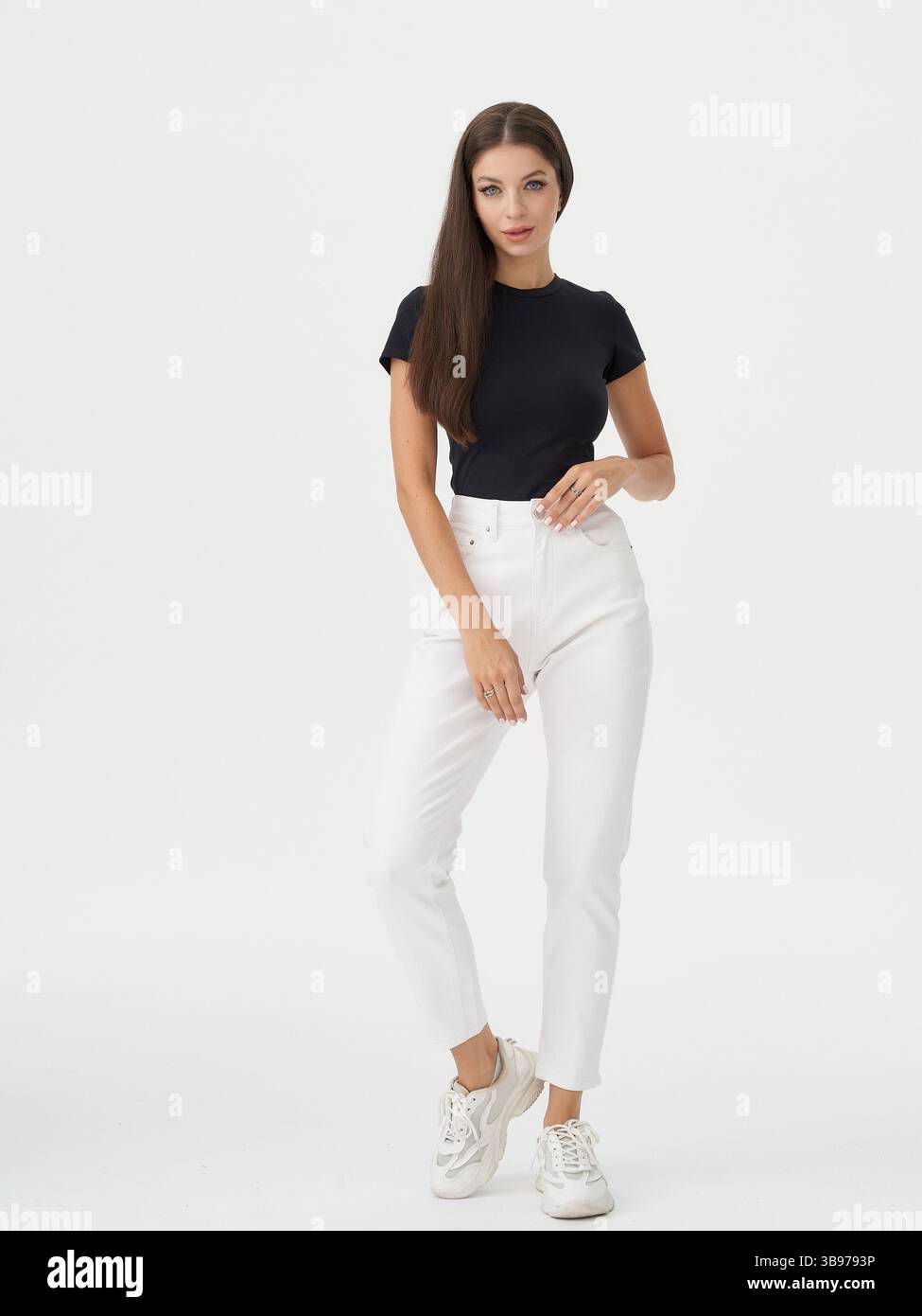 Model showcasing modern fashion in a chic studio space while posing ...