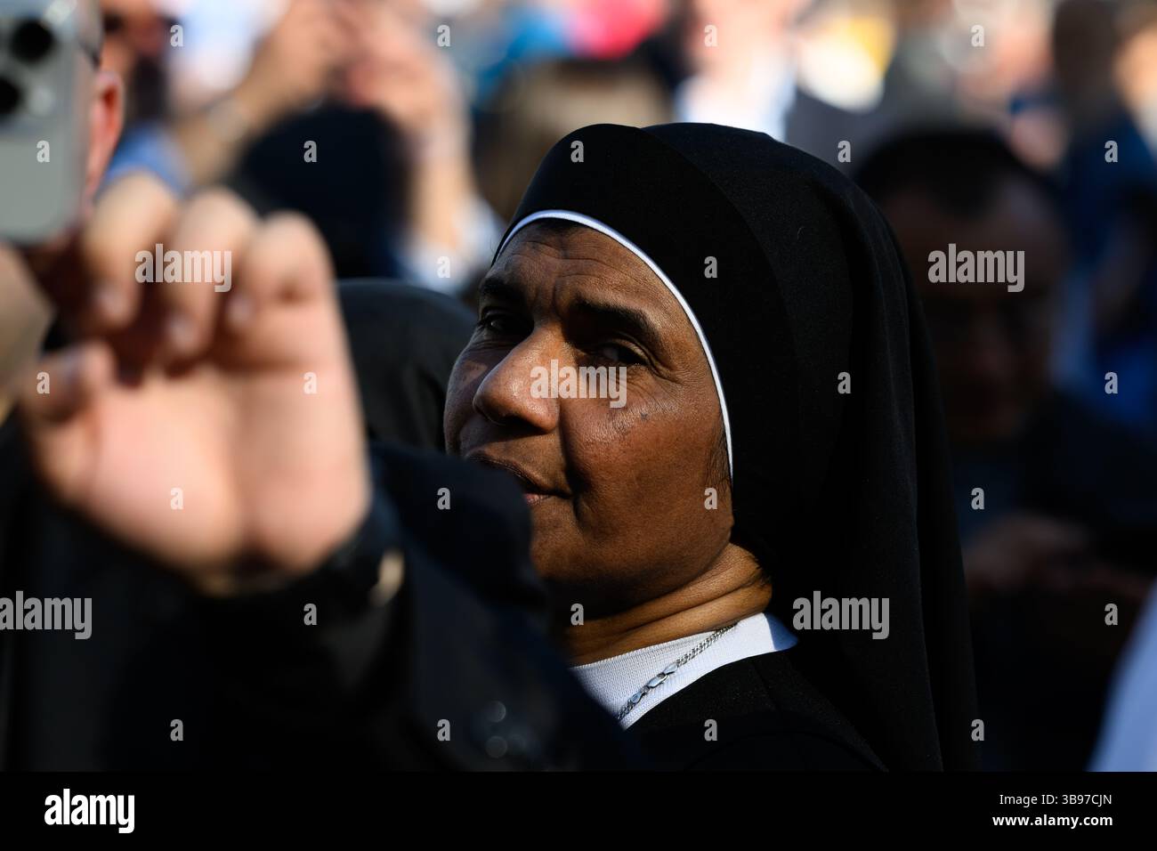 Vatican City, Italy. 08th May, 2025. A nun looks on during the conclave ...