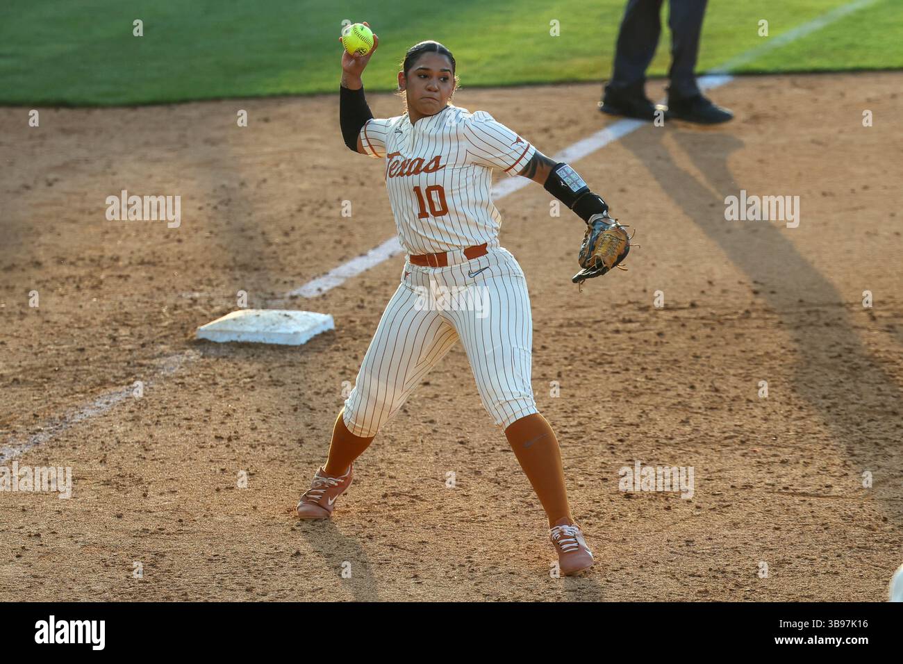 ATHENS, GA - MAY 08: Texas utility Mia Scott (10) throws out a runner at first during the SEC ...