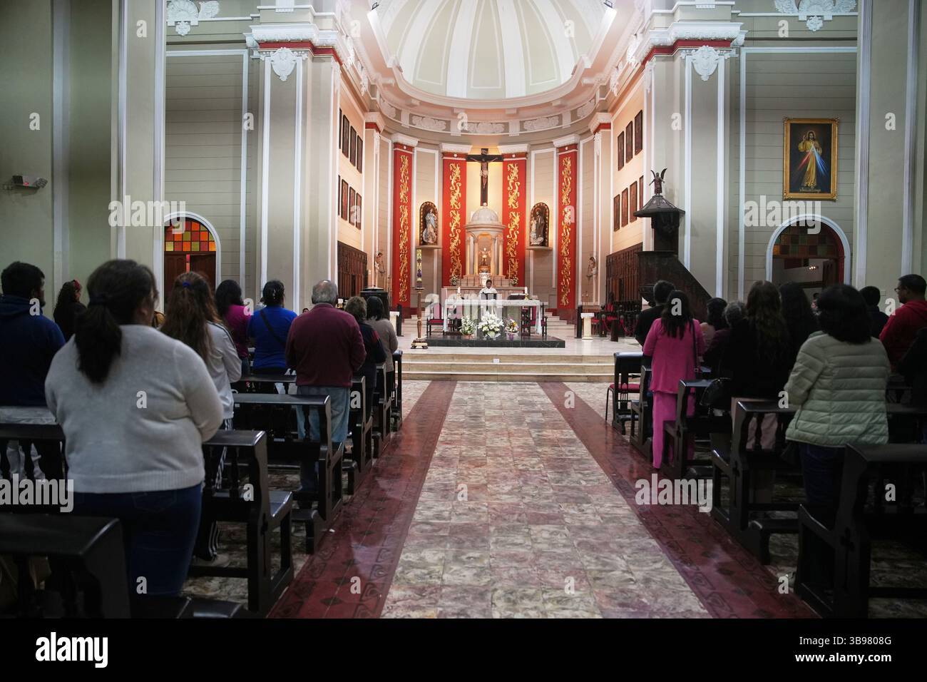 Parishioners attend Mass at the Santa Maria Cathedral, the episcopal ...
