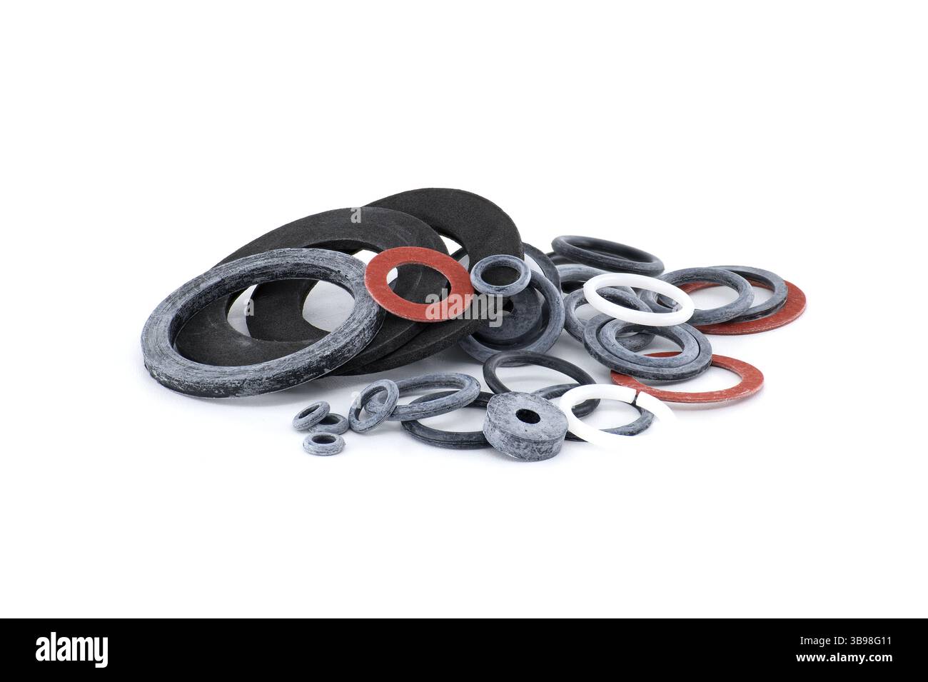 A collection of various sized and colored industrial gaskets are ...