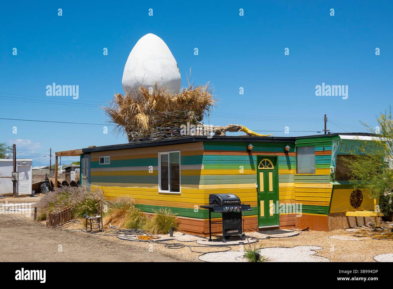 Huge egg in nest on house rooftop as a part of nstallation art at the ...