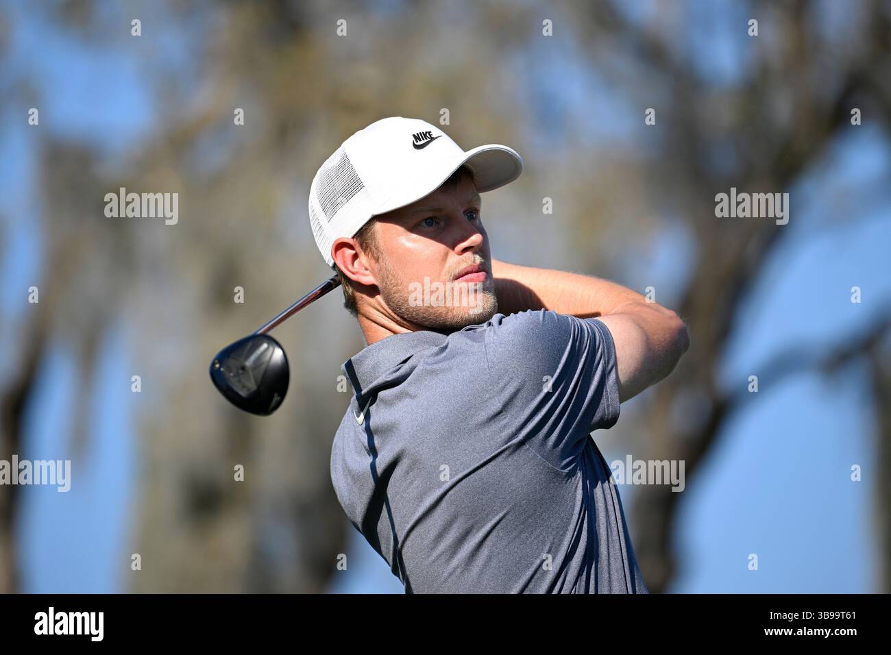 Cameron Davis, of Australia, looks on after hitting his tee shot on the ...