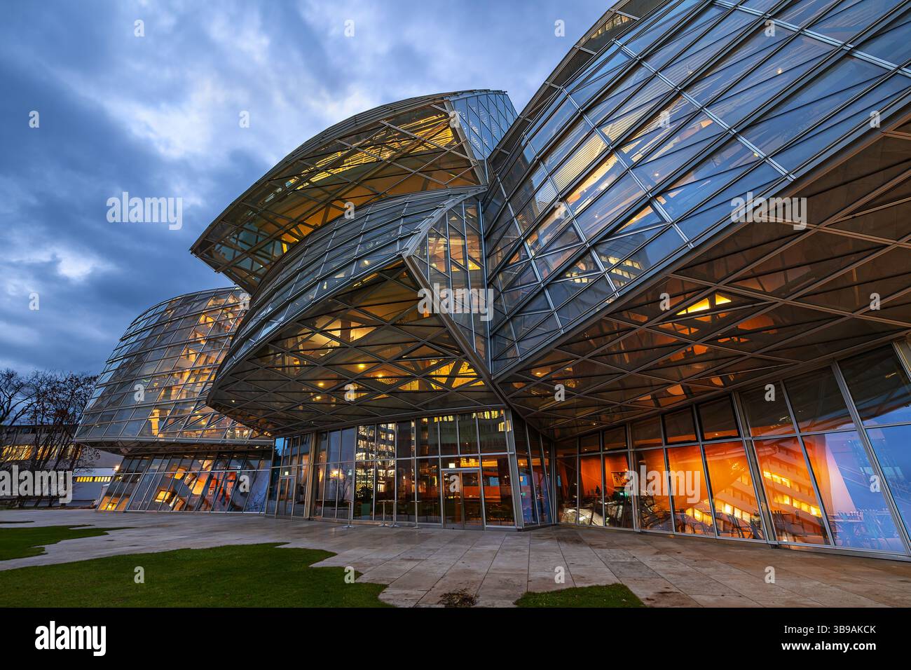 Basel, Switzerland - 09 December, 2024: The Gehry Building of Novartis company at blue hour ...