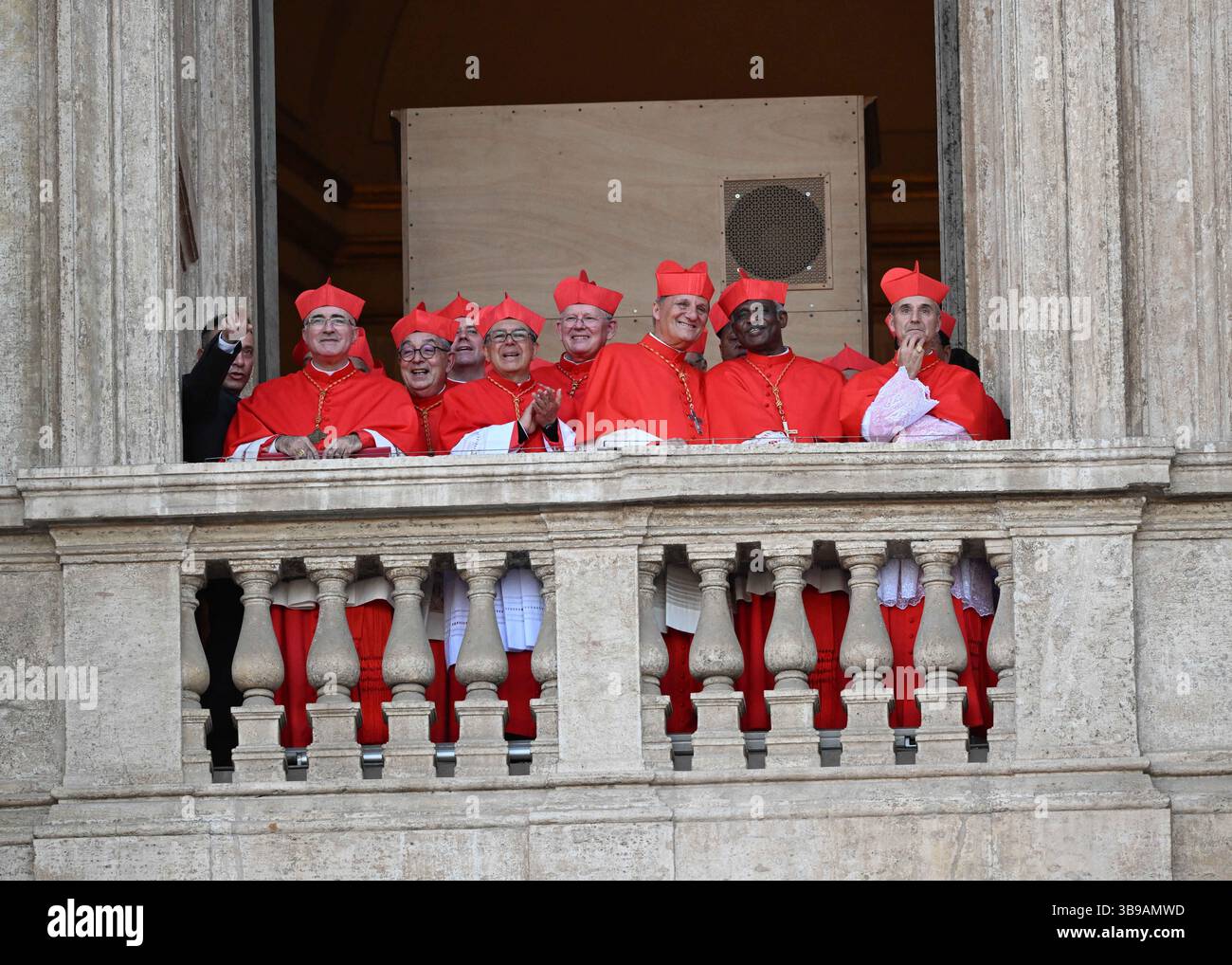Cardinals look from a balcony as new pope Leo XIV appears at the ...
