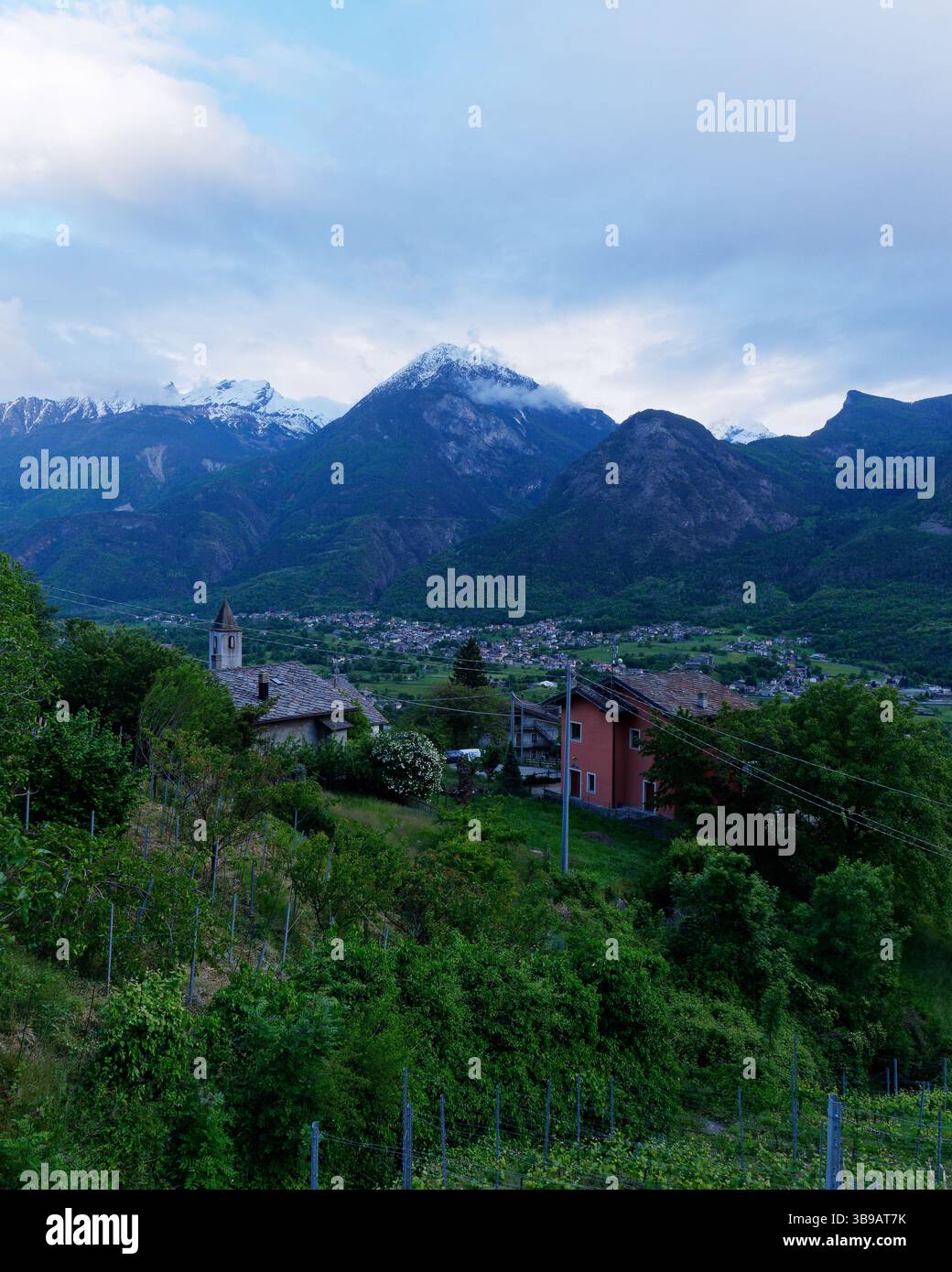 Village of Les Granges near Nus with the town of Fenis and Snow capped ...