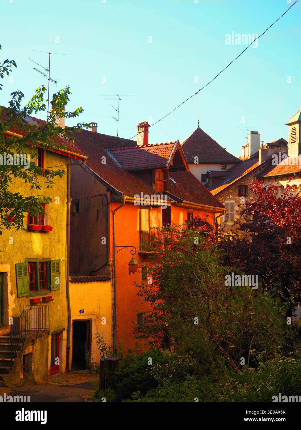 Colorful French village houses in Annecy at golden hour, France Stock ...
