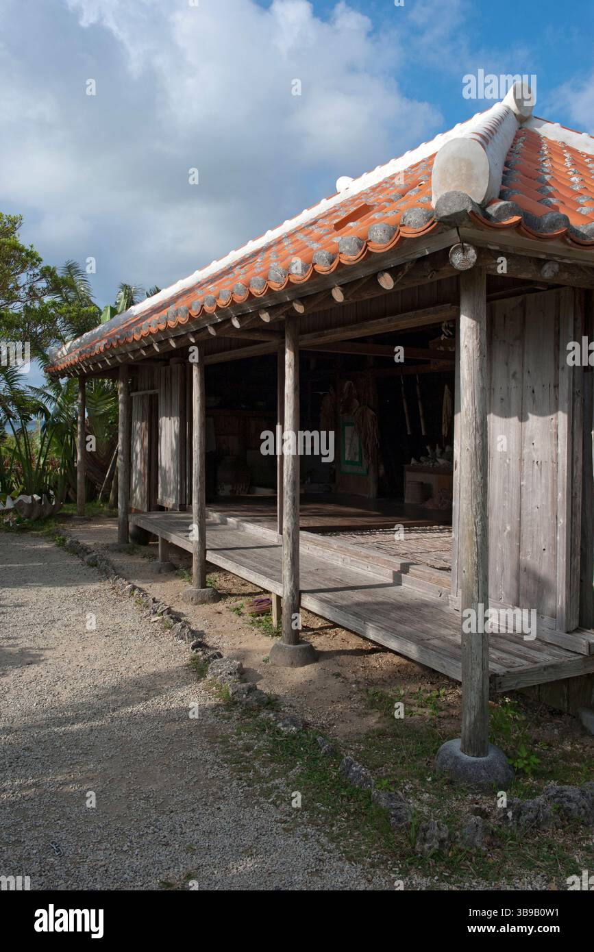 Traditional Okinawan residence with open floor plan, tile roof and ...