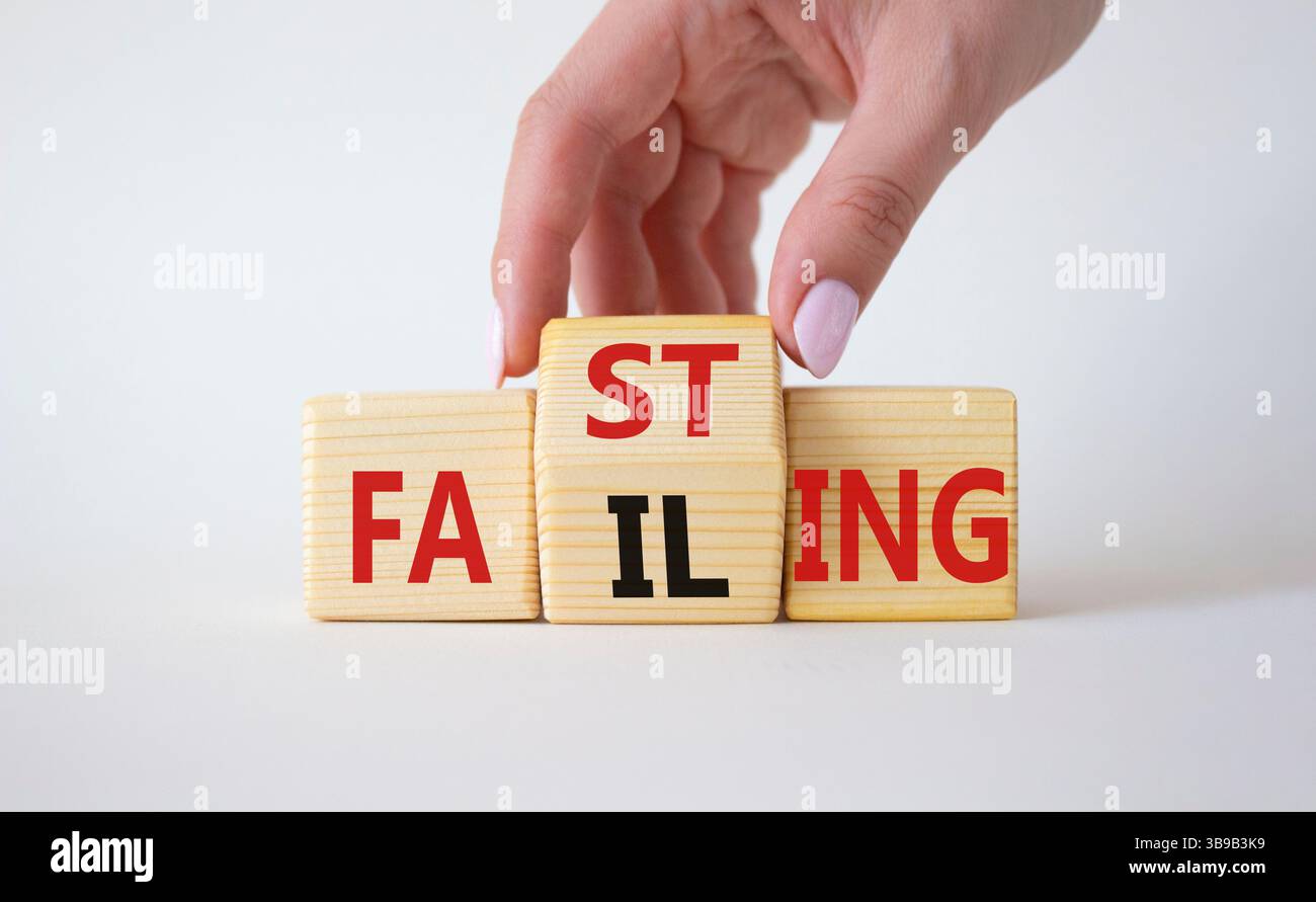 Fasting vs Failing symbol. Businessman hand turns wooden cubes and ...