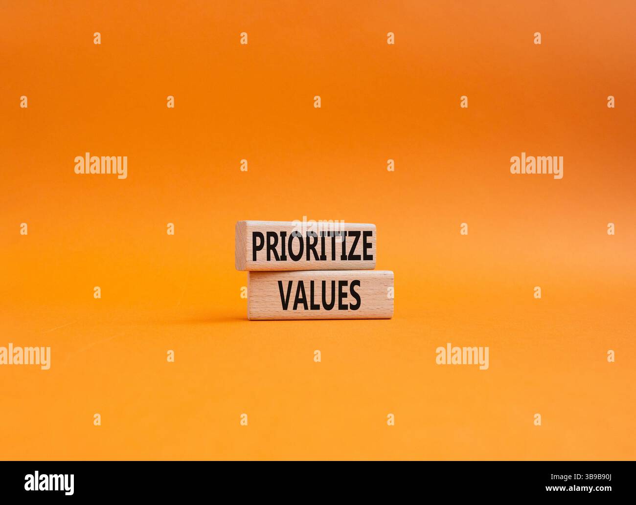 Prioritize values symbol. Concept word Prioritize values on wooden ...