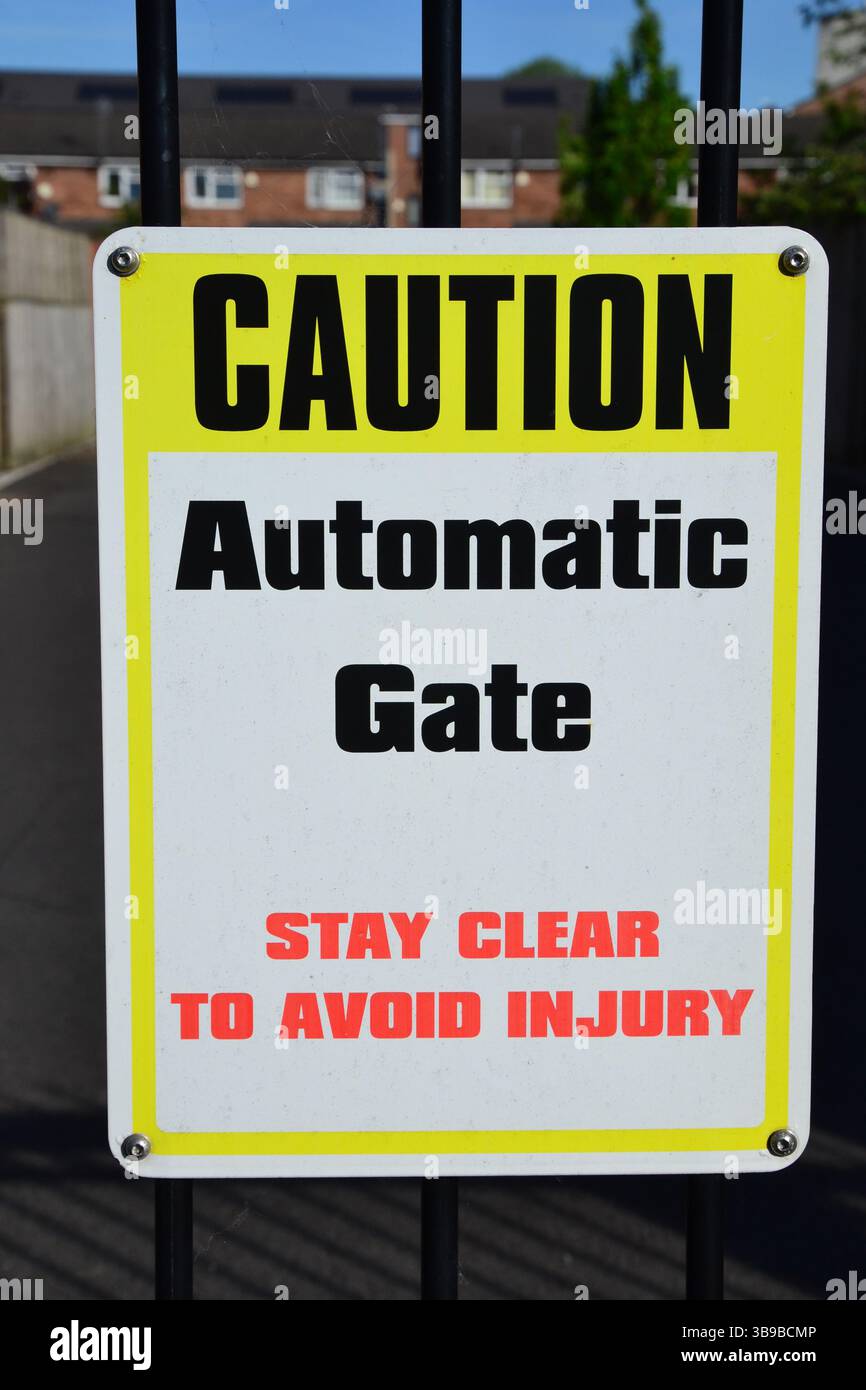 A Caution automatic gate sign in Manchester, UK Stock Photo - Alamy