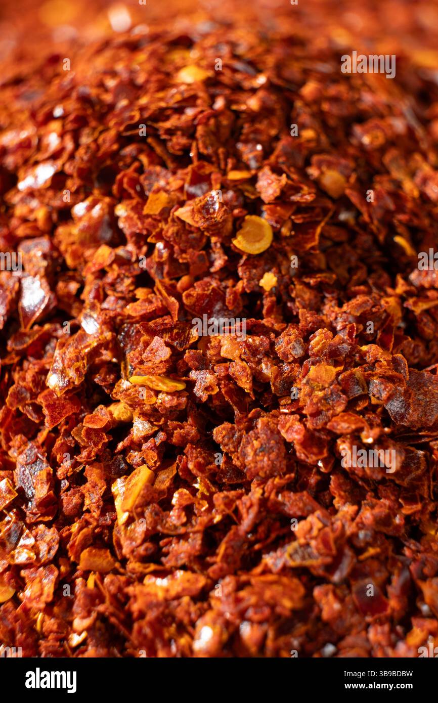 Dried and ground chili flakes intense spice Stock Photo - Alamy