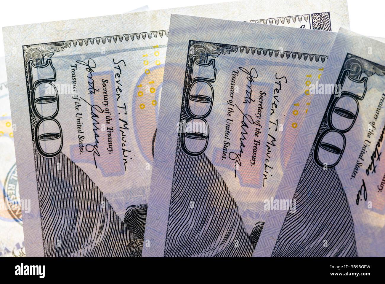 a group of American hundred dollar new banknotes transparent from the ...