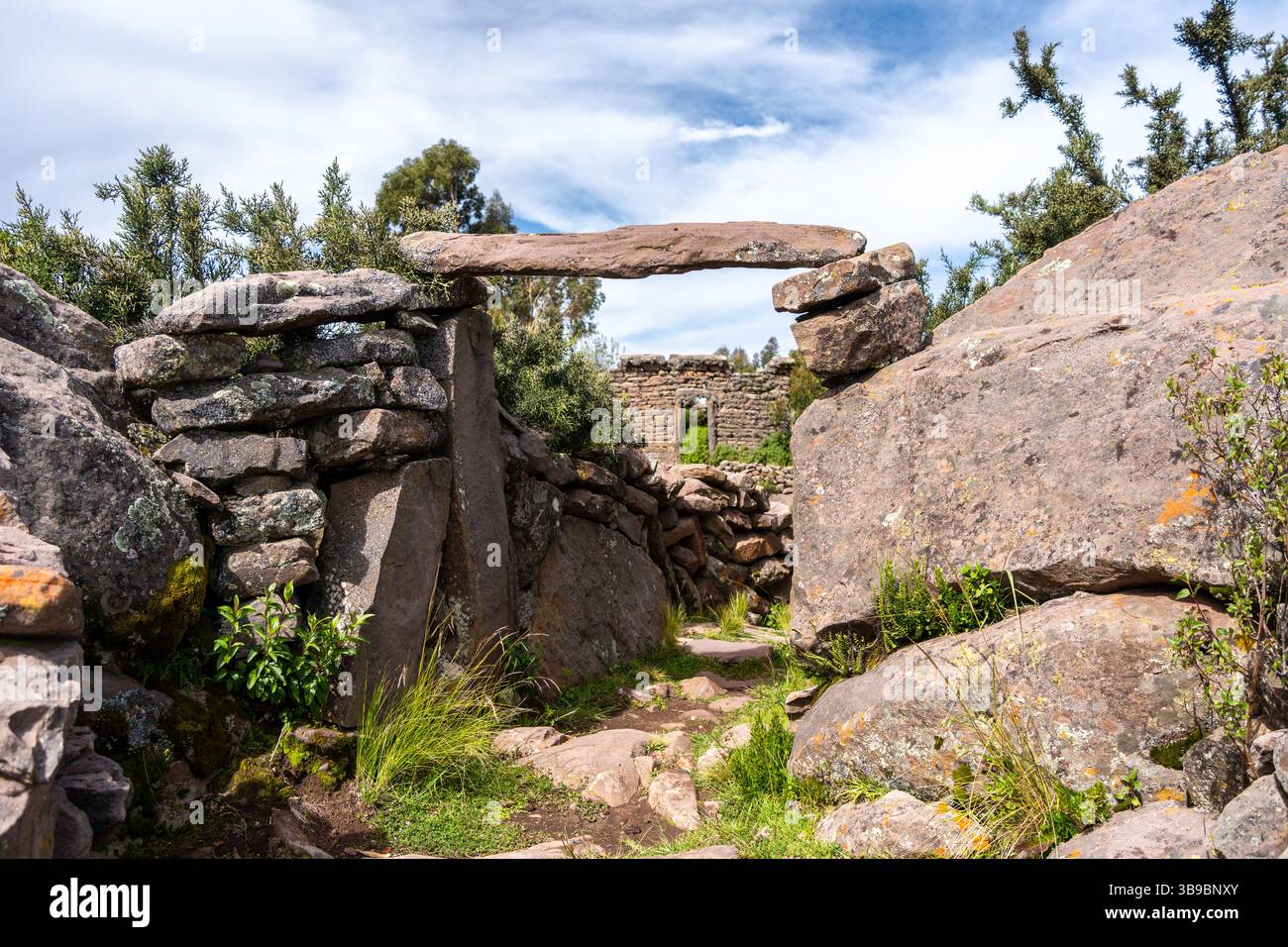 Ancient stone ruins from a pre-Inca civilization stand on Taquile ...