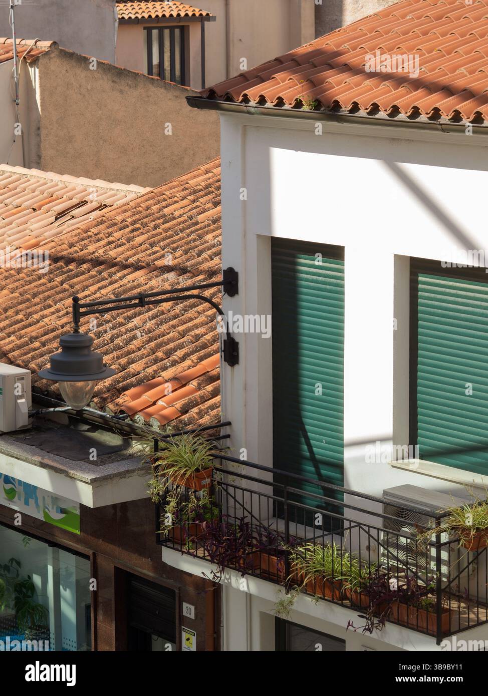Vertical Wide-Angle View of Terracotta Rooftops and Layered ...