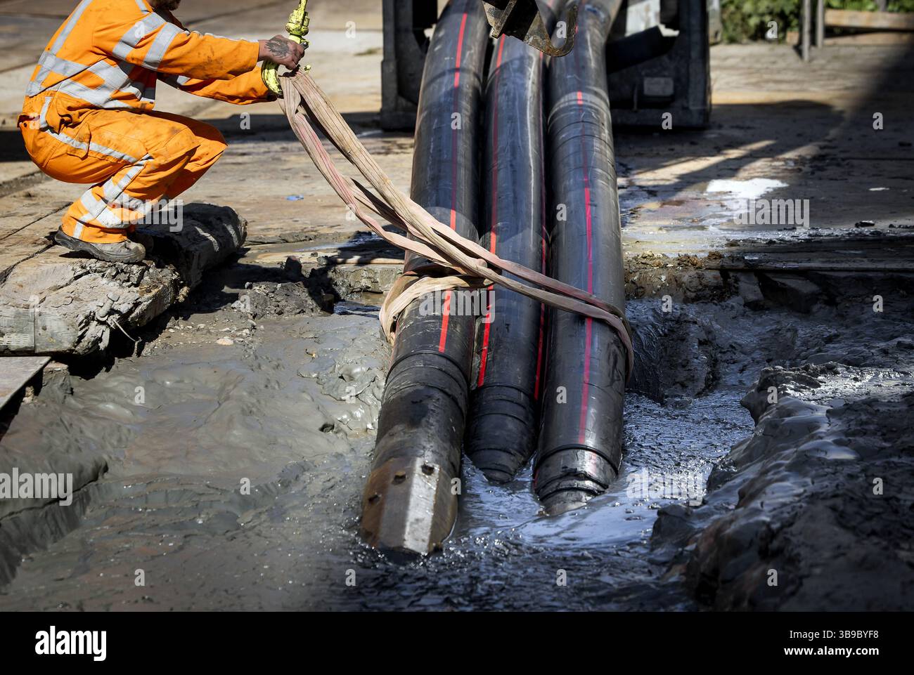 AMSTERDAM - Casing tubes for electricity cables are being pulled into a ...