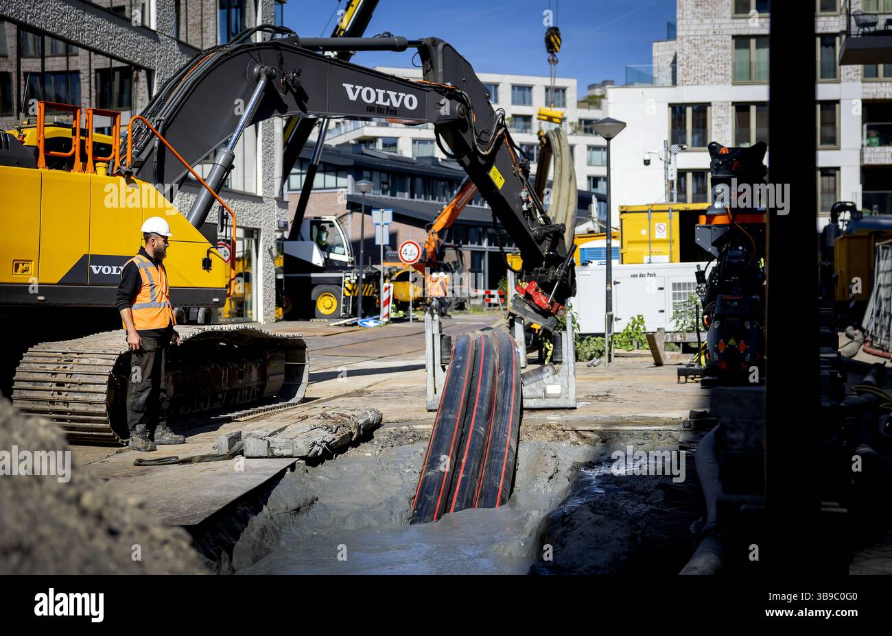 AMSTERDAM - Casing tubes for electricity cables are being pulled into a ...