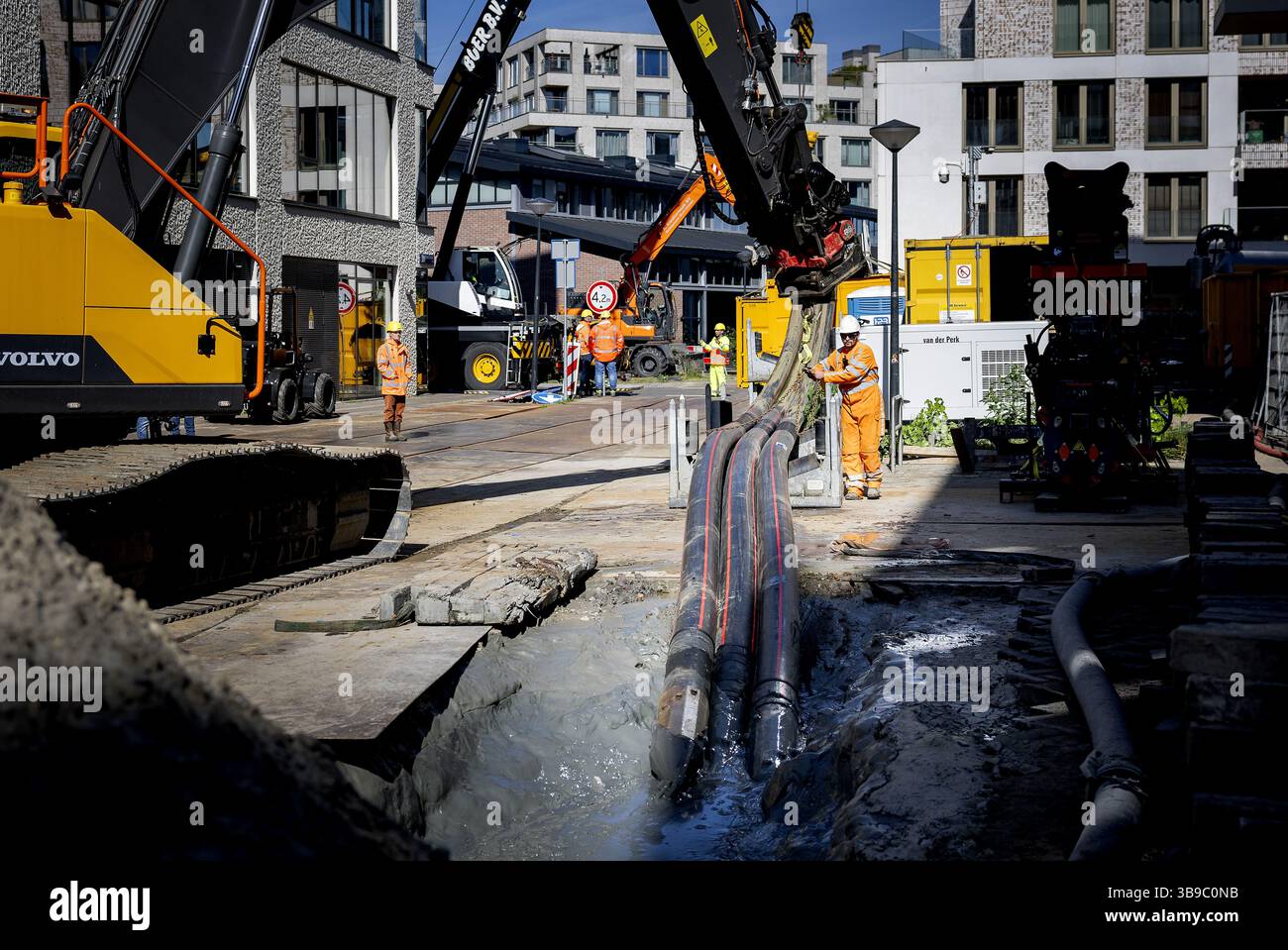 AMSTERDAM - Casing tubes for electricity cables are being pulled into a ...