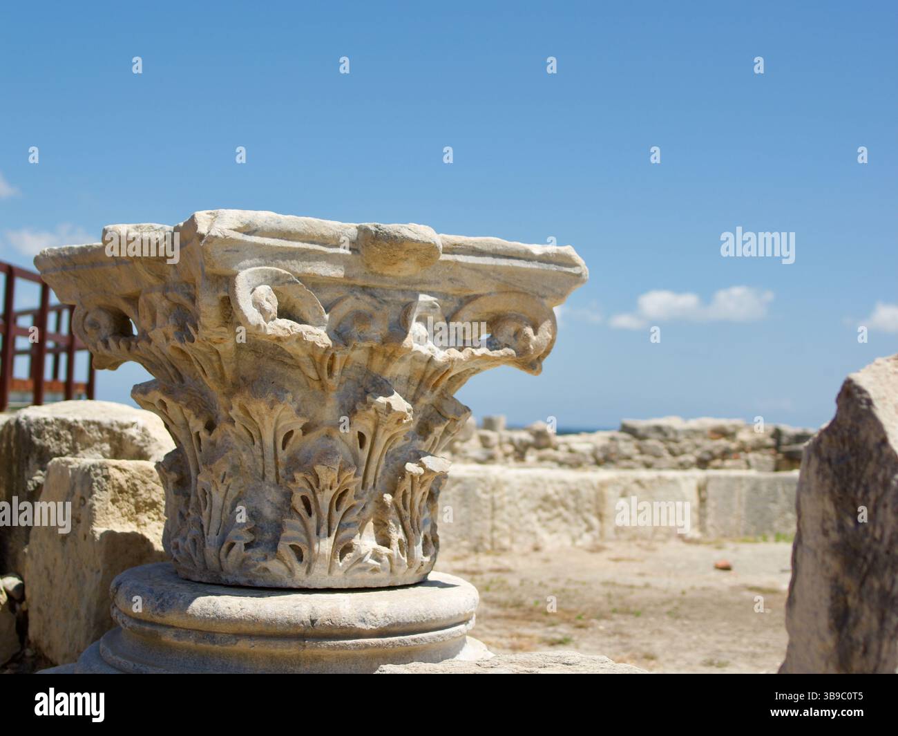 A beautifully detailed ancient stone column capital situated in the ...