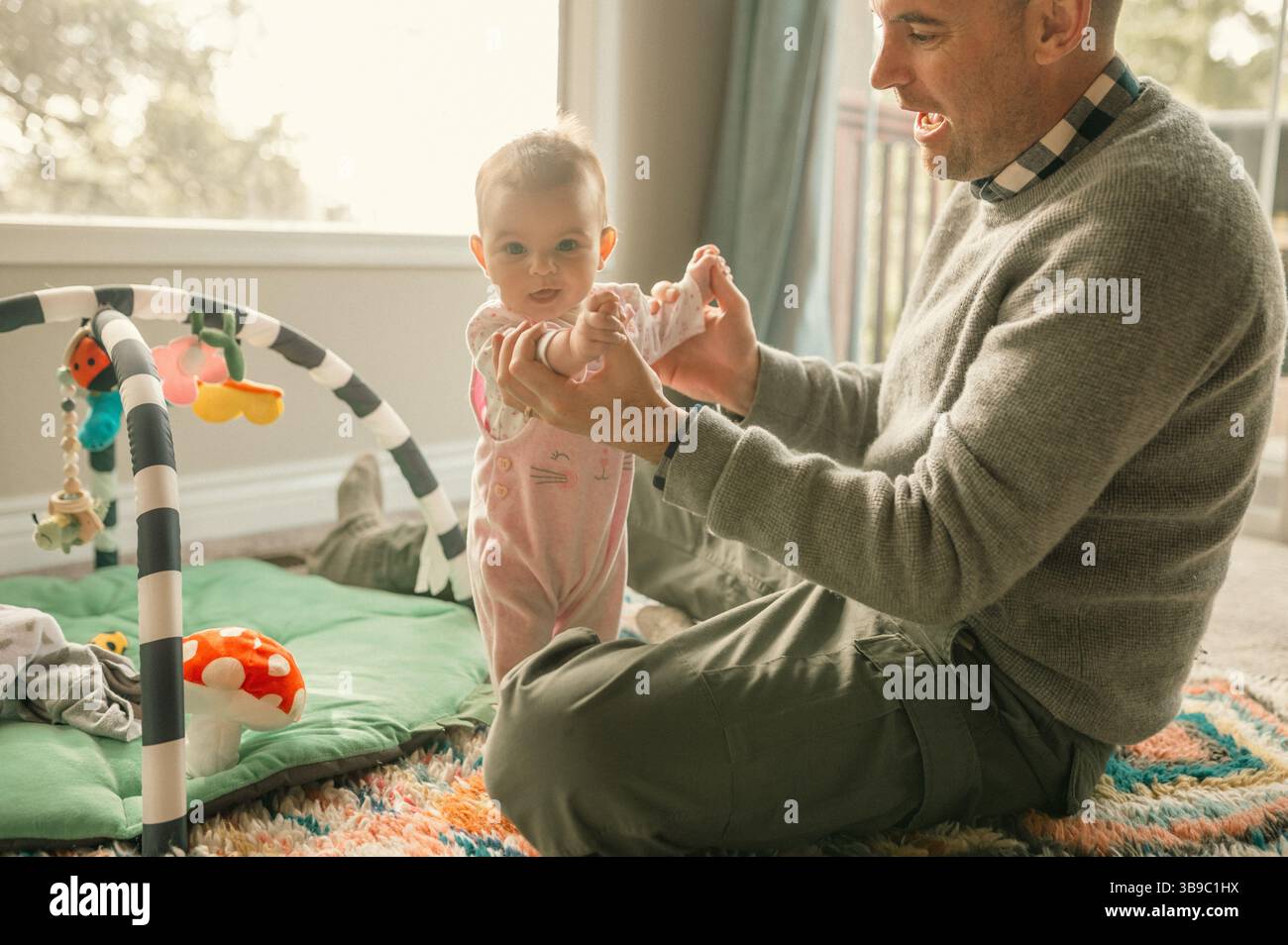 Father supports child learning hi-res stock photography and images - Alamy