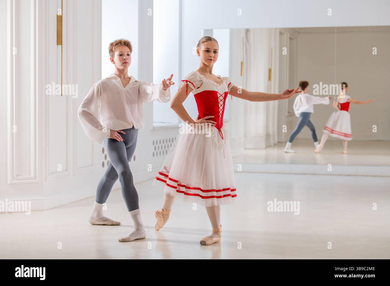 Ballet Duo Dancing Gracefully in Elegant Dance Studio Stock Photo - Alamy