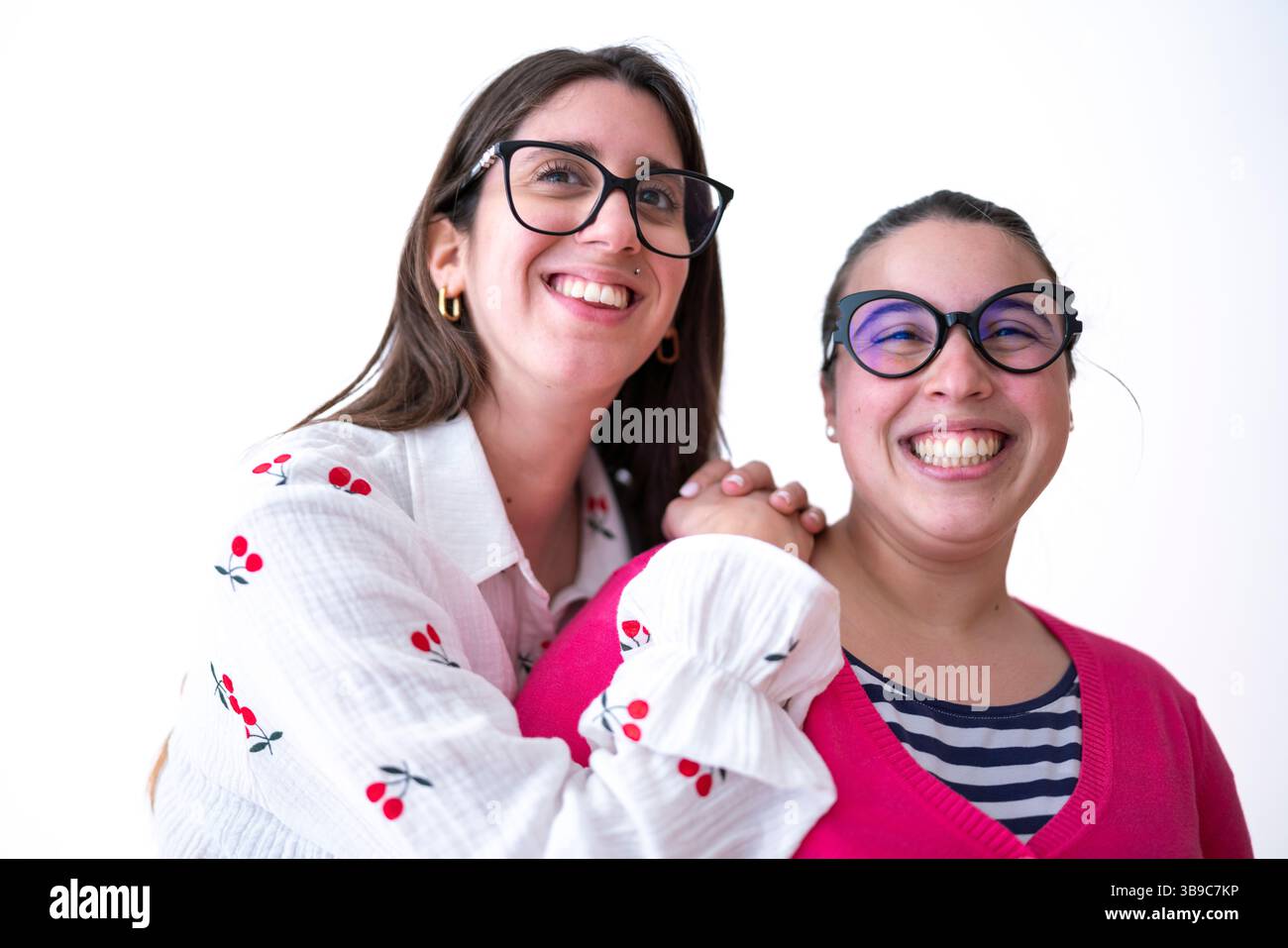 Two Happy Women Smiling and Posing Together Stock Photo - Alamy