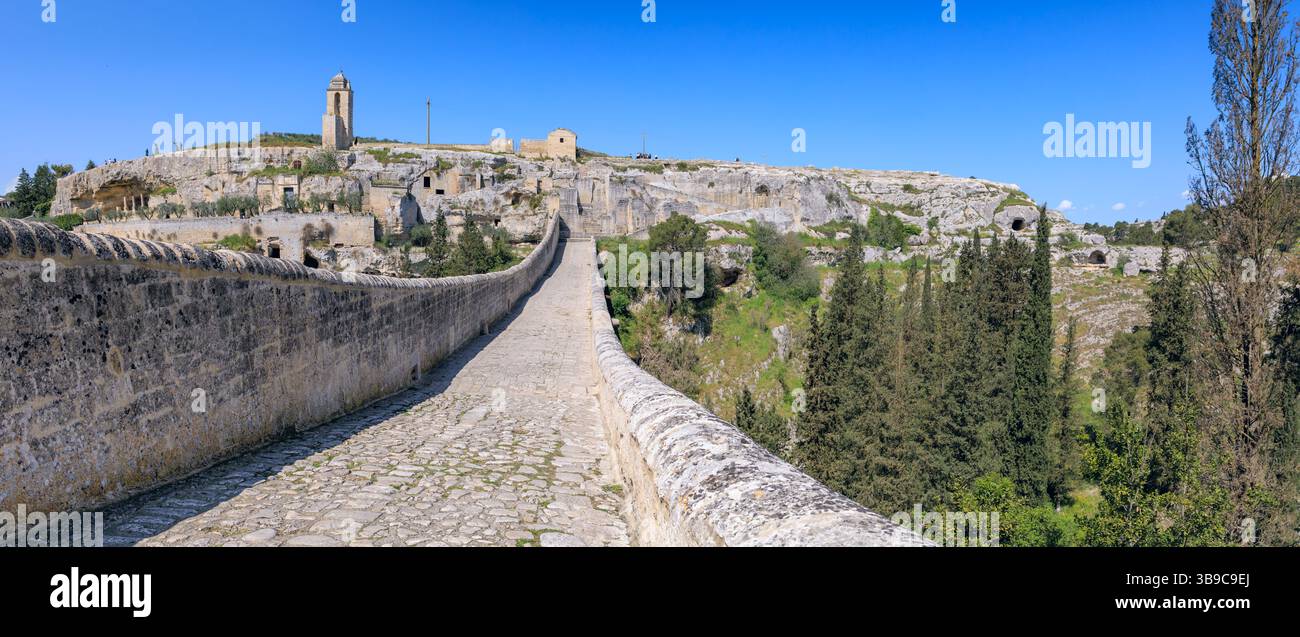 View of the Aqueduct Bridge from Roman times and cave houses in Gravina ...