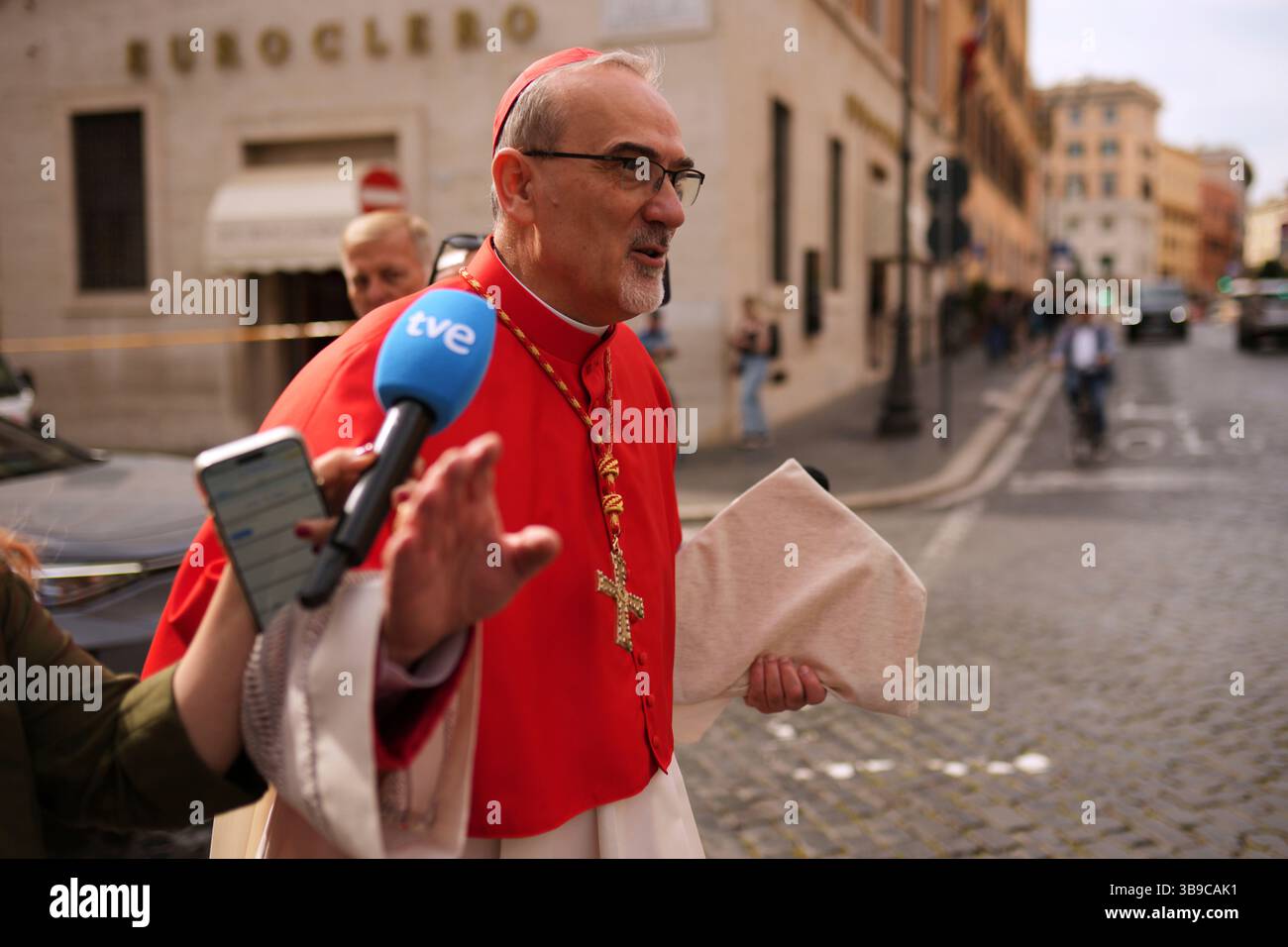 Cardinal Pierbattista Pizzaballa walks by journalists as he arrives at ...