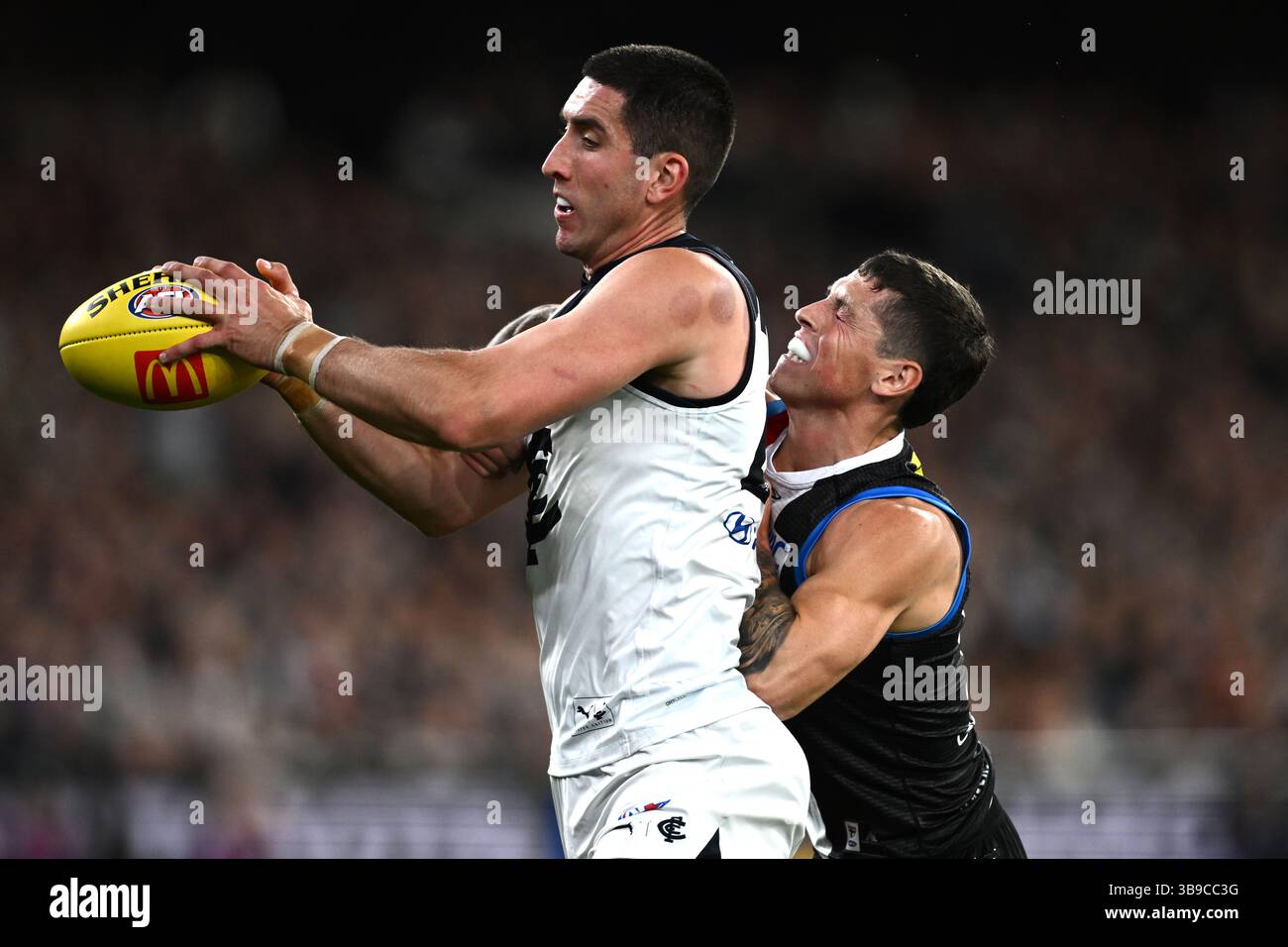 Melbourne, Australia. 09th May, 2025. Jacob Weitering of Carlton takes a mark during the AFL ...