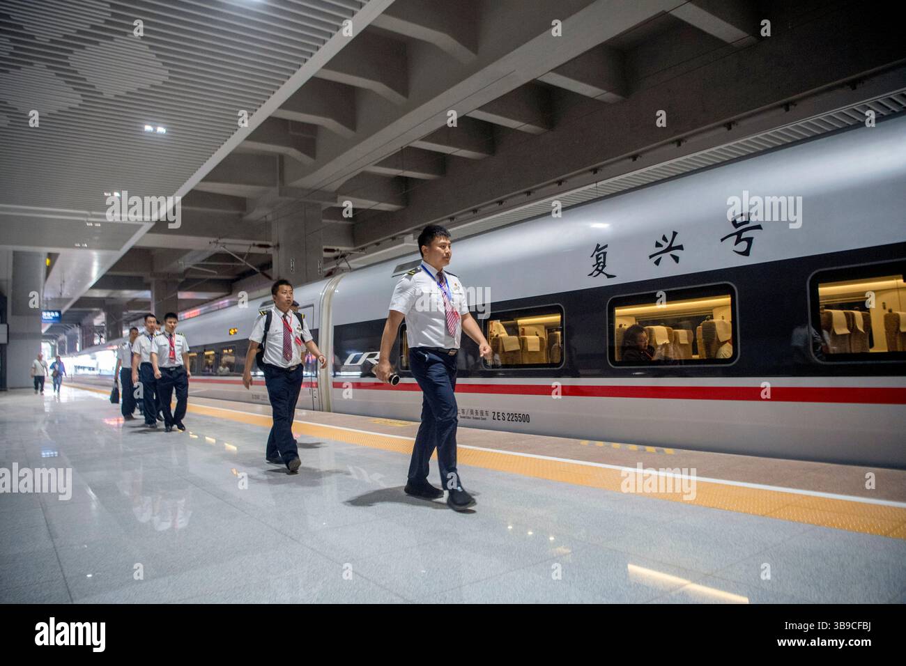 Chongqing. 9th May, 2025. Railway staff prepare to board the high-speed ...