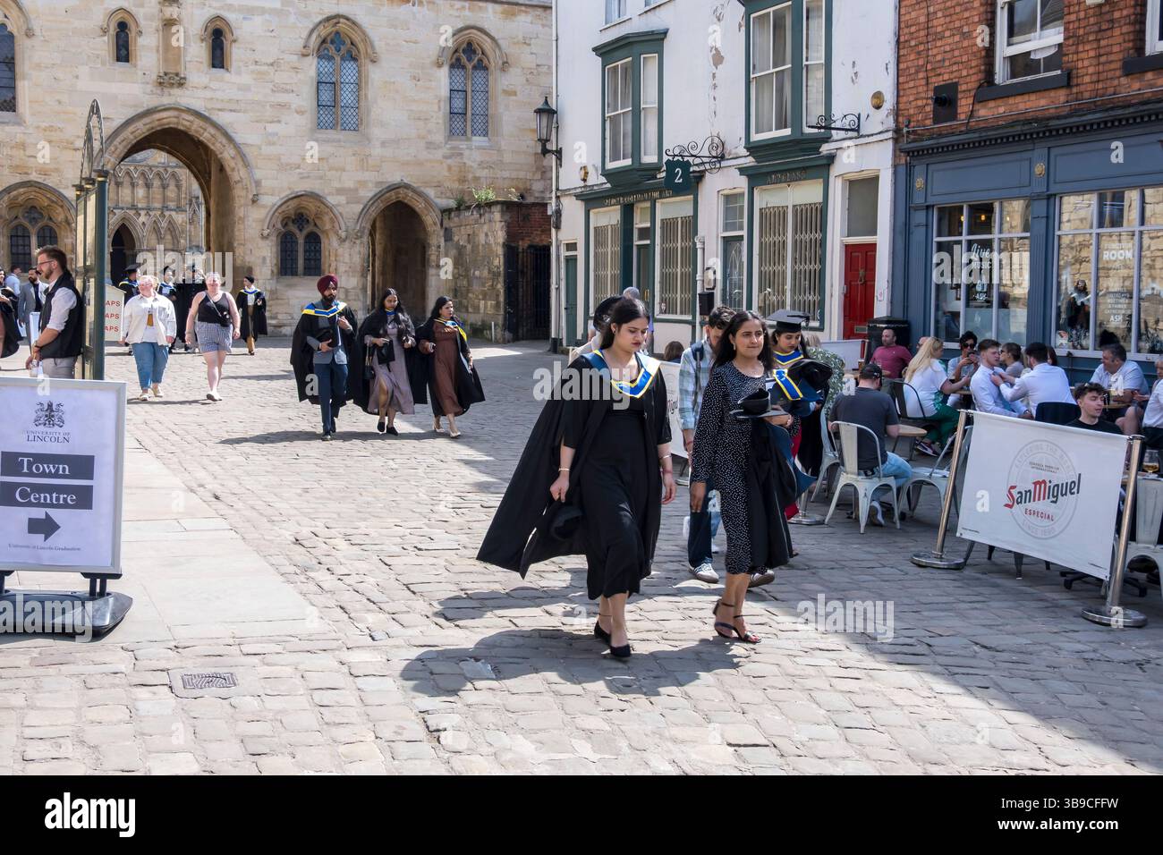 Graduate students walking along Exchequer Gate from Cathedral to Castle ...