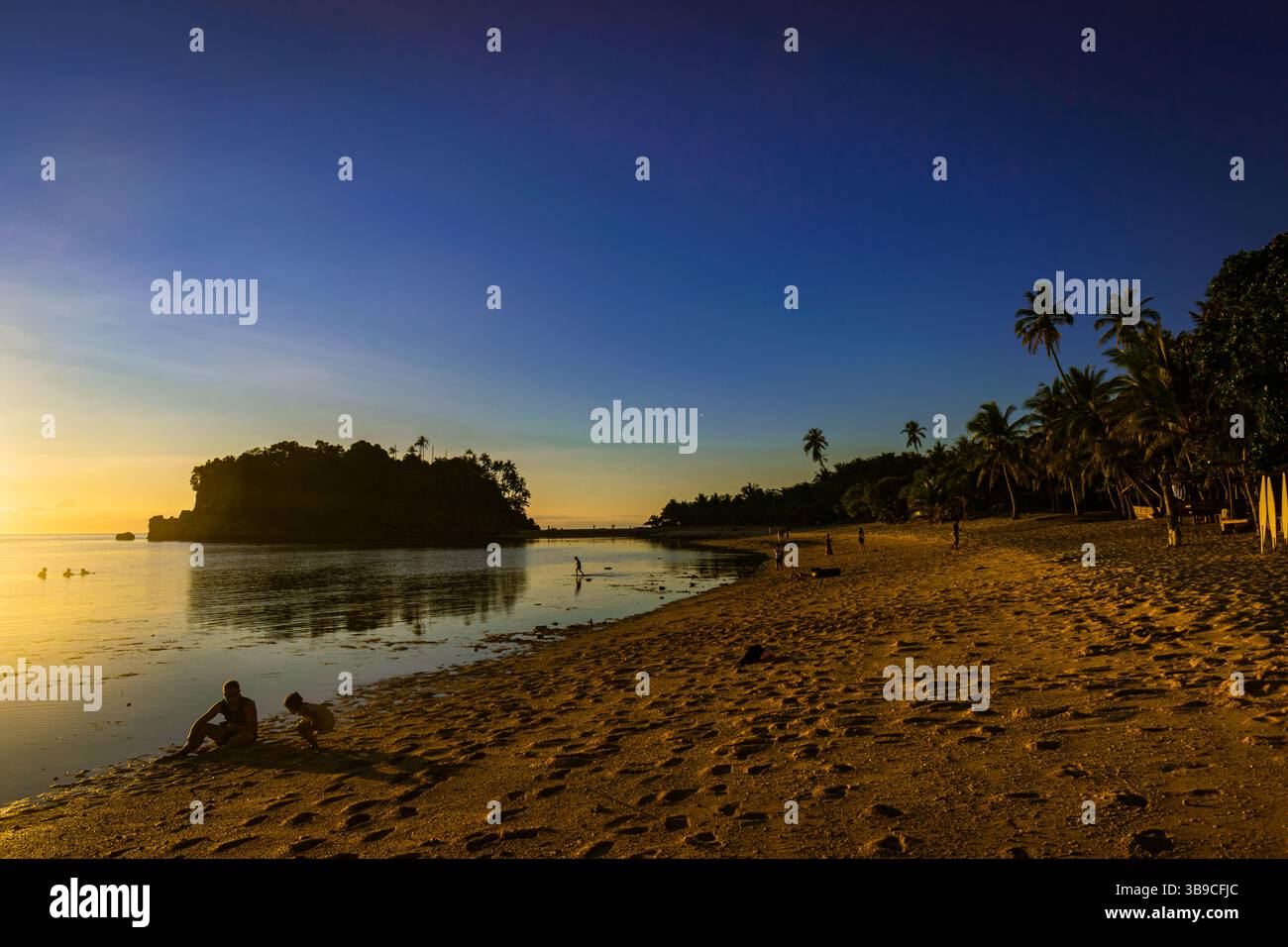 Tropical beach with white sand at sunset. Binucot Beach, Ferrol ...