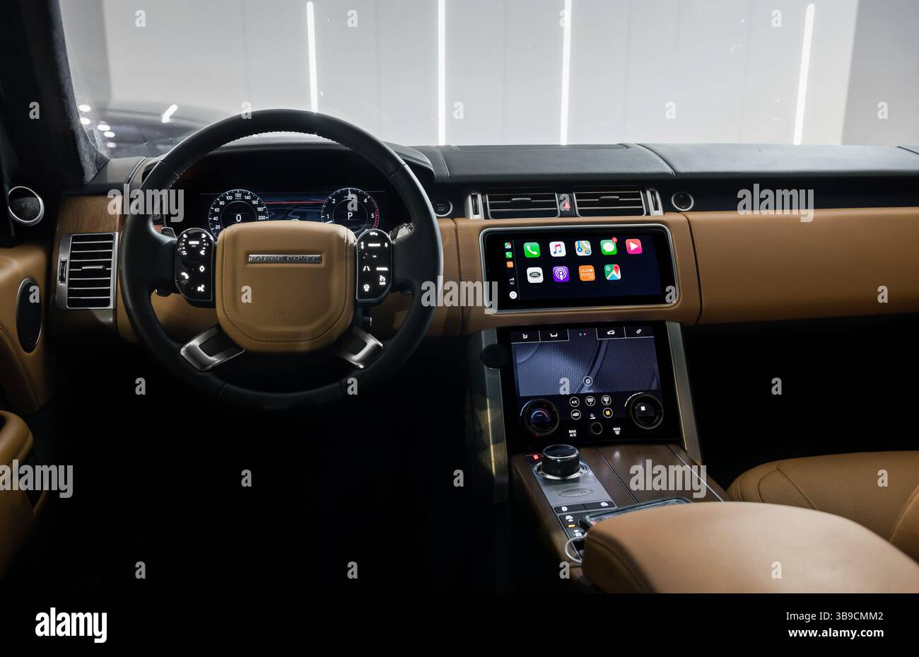 Range Rover interior with tan leather. Car front panel wide angle view ...