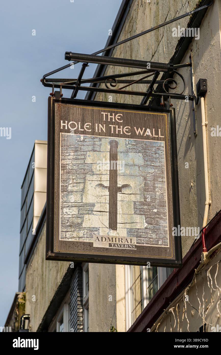 The Hole in the Wall pub sign, Caernarfon, Gwynedd, Wales, UK Stock ...