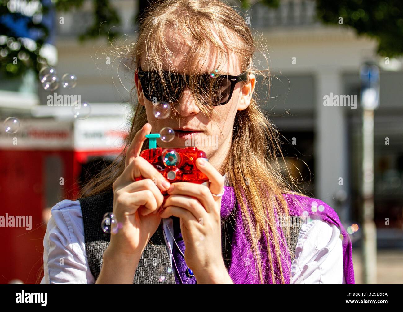 Happy people blowing buubles hi-res stock photography and images - Alamy