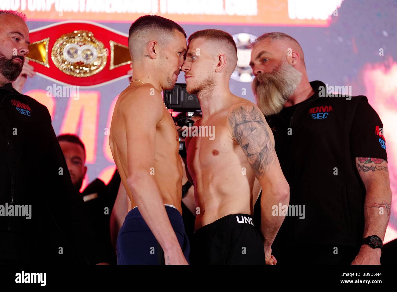 Liam Davies and Kurt Walker (right) face off during the weigh in at the ...