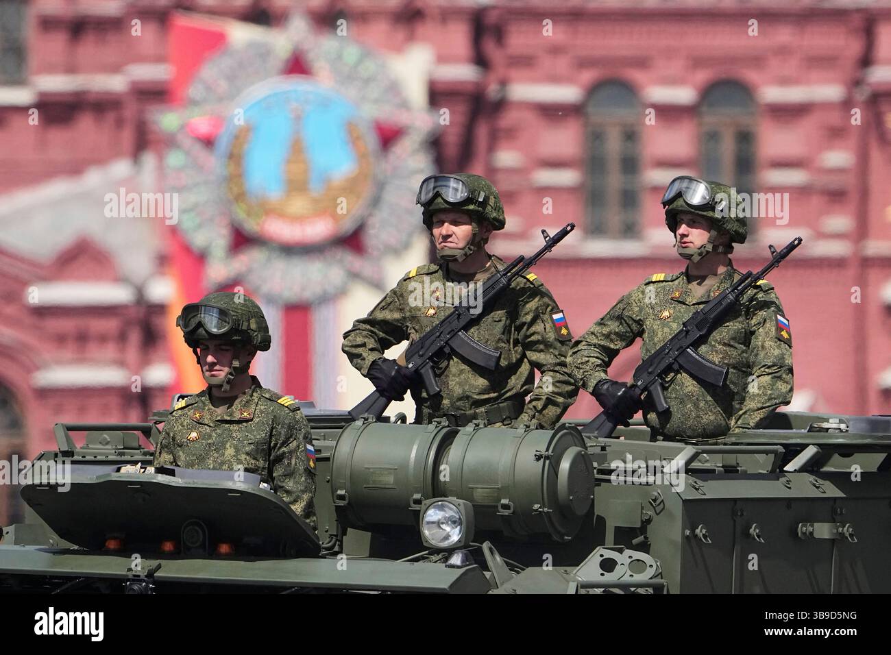 Russian servicemen ride atop the APC along Red Square during the ...